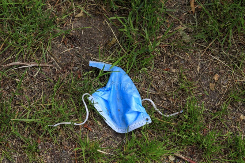Face Mask in Grass stock photo. Image of pandemic, infection - 192009420