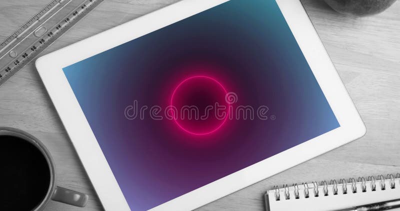 Image of Tablet with Neon Circles Moving on Screen on Desk Stock Photo ...