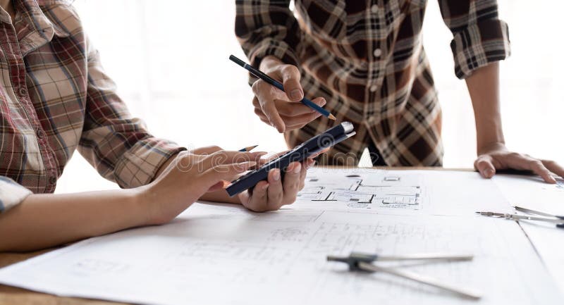 Image of Team Engineer and Architect Discuss for Construction ...