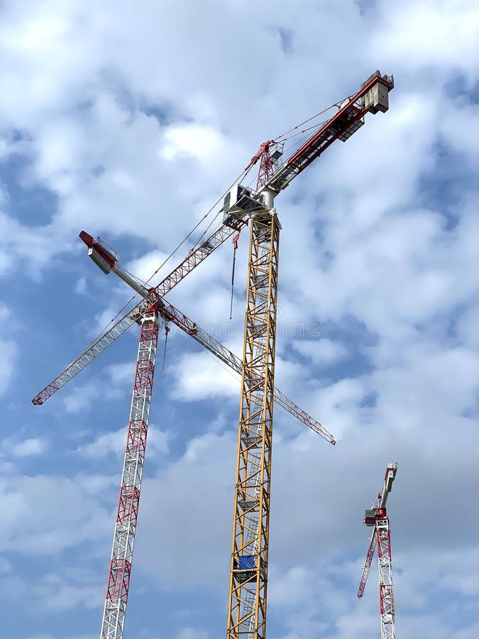 Image of Three Cranes Working Together on the Construction Site Stock ...