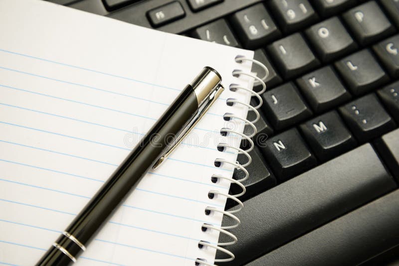 Pen and Notebook on Computer Keyboard Stock Image - Image of desk ...
