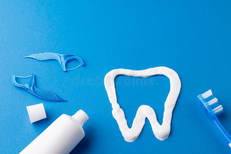 Image of Toothbrush, Toothpaste, Strings and Tooth Made of Paste on ...