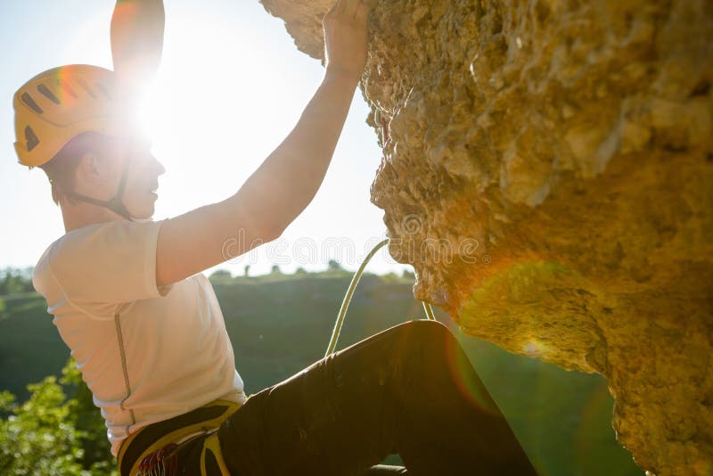 Image of Tourist Man in Helmet Clambering Up Stock Image - Image of ...