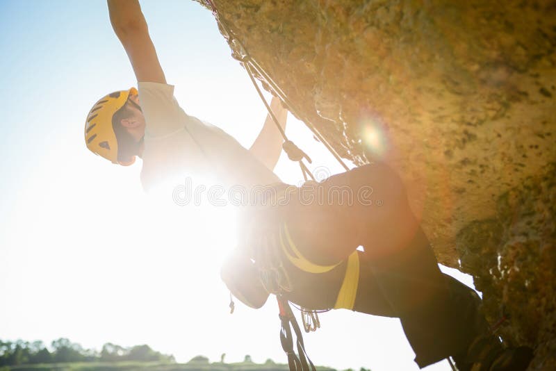 Image of Tourist Man in Helmet Clambering Up Stock Photo - Image of ...