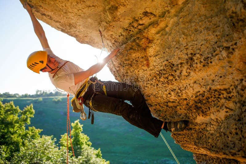 Image of Man Clambering Over Rock. Stock Image - Image of leisure ...
