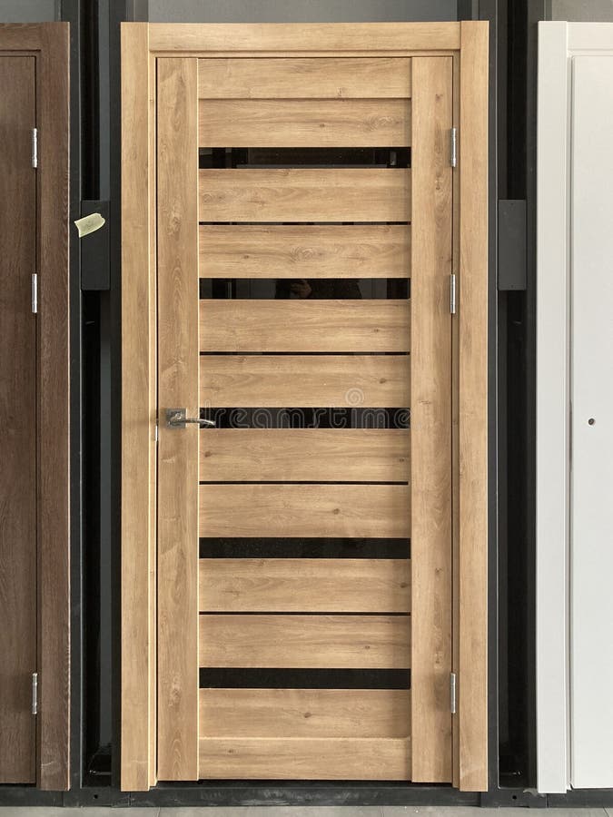 Image of Two Interior Doors on Display, One Dark Wood-grain and the ...