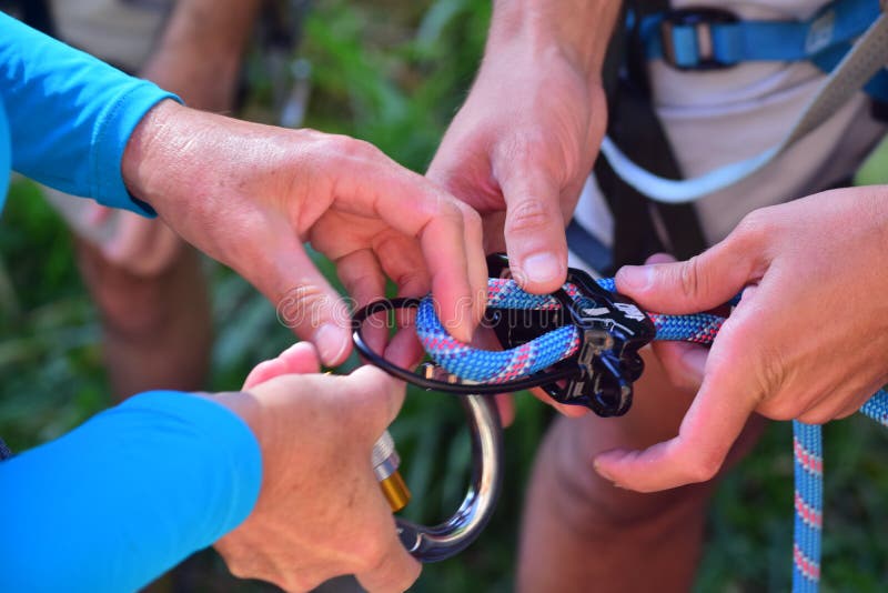 Image of Two People Setting Up a Climbing Safety Stock Image - Image of ...