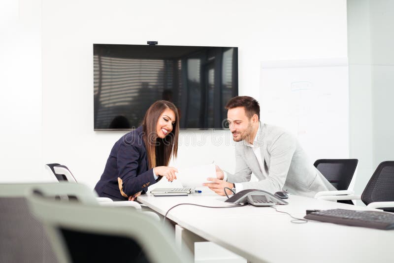 Image of Two Successful Business Partners Working at Meeting in Office ...