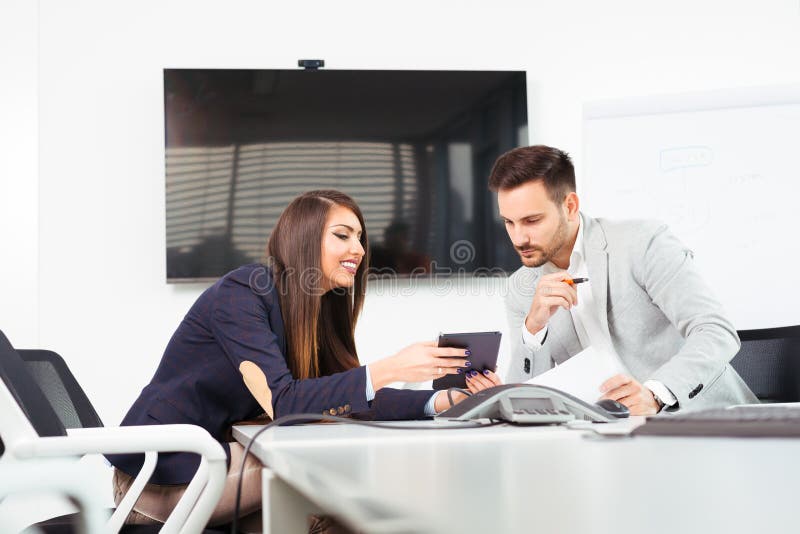 Image of Two Successful Business Partners Working at Meeting in Office ...