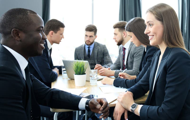 Image of Two Young Business People Interacting at Meeting in Office ...