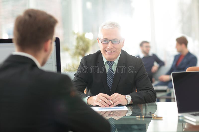 Image of Two Young Businessmen Using Computer at Meeting Stock Photo ...