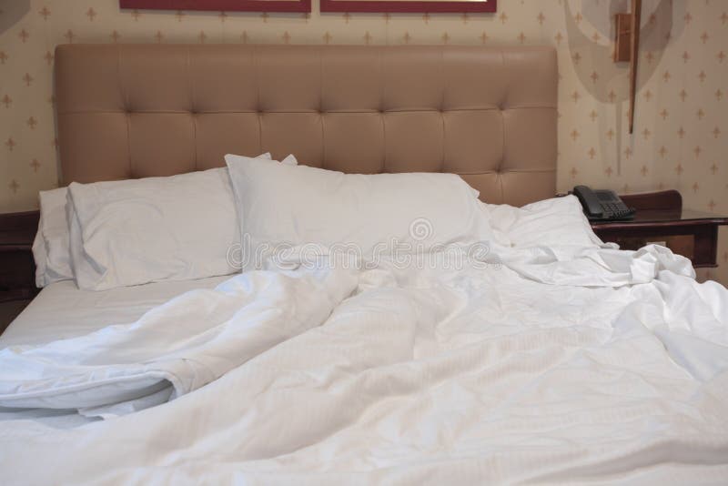 Image of Unmade Double Bed in a Hotel Stock Photo - Image of luxury ...