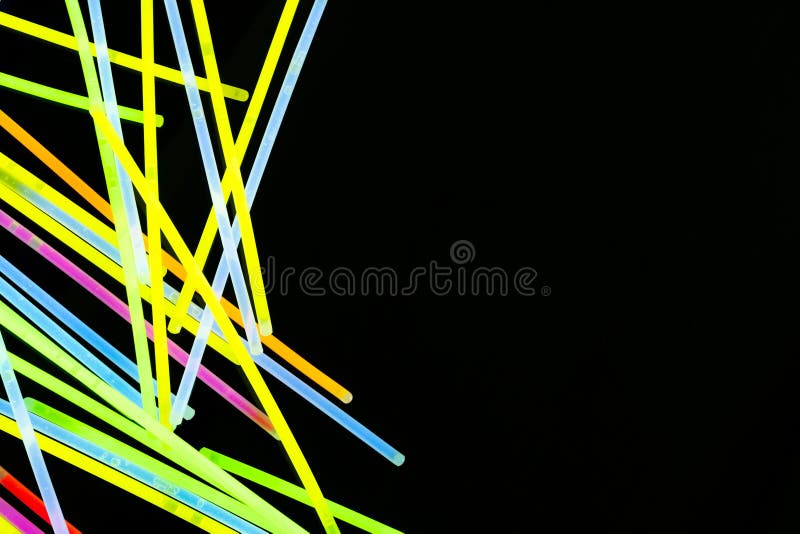 Image of Vibrant Stack of Neon Glow Sticks Scattered Over Black ...