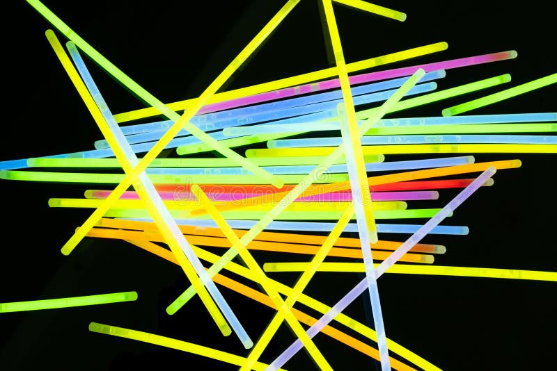 Image of Vibrant Stack of Neon Glow Sticks Scattered Over Black ...