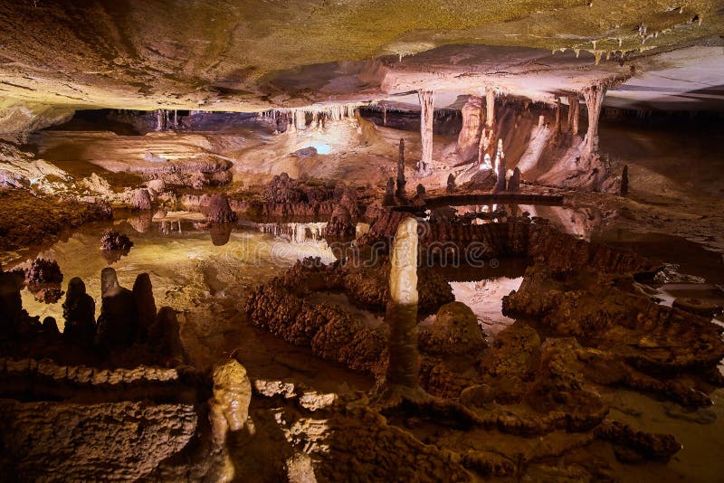 View of Large Open Cave Filled with Reflective Waters, Stalagmites and ...