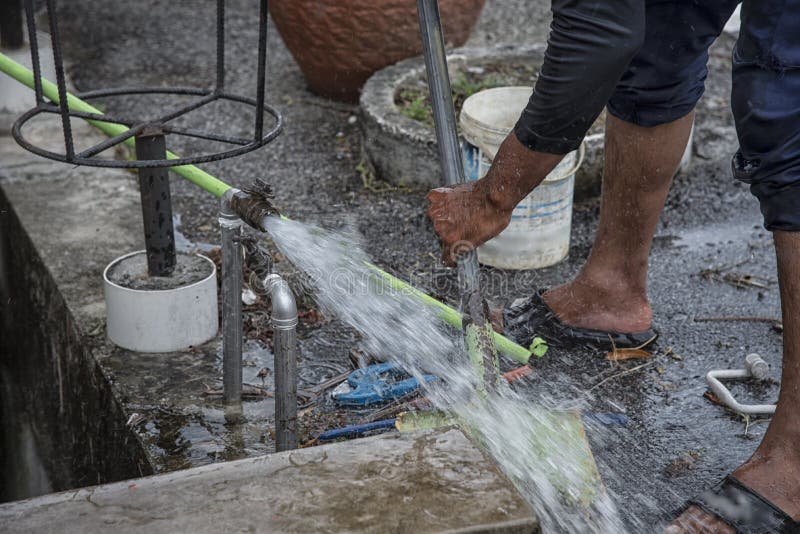 Washing Hand,legs and Plumbing Tools with the Burst Water Pipe ...