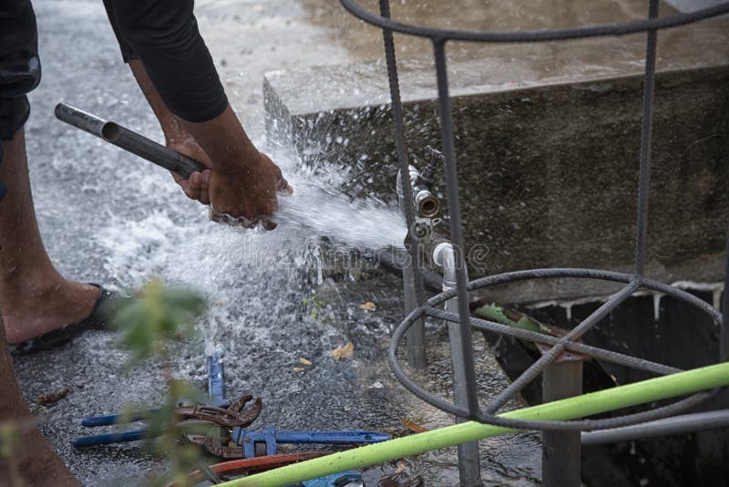 Washing Hand,legs and Plumbing Tools with the Burst Water Pipe ...