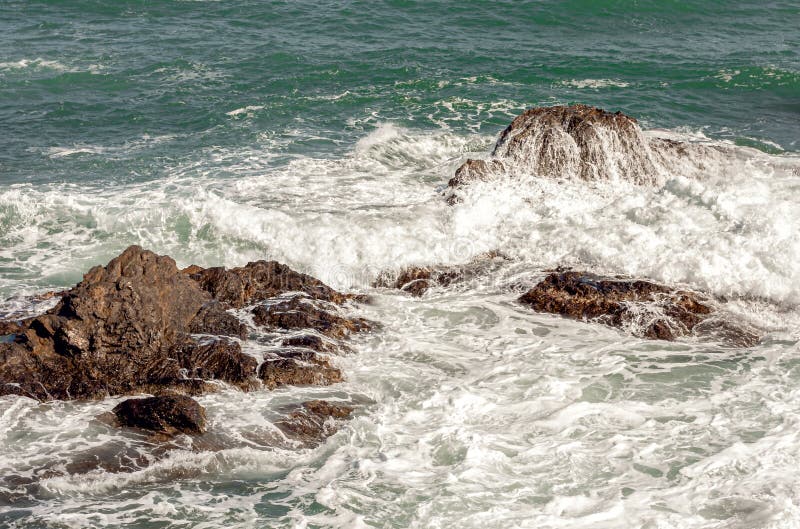 Image of Water Falling on a Rock after a Wave Has Crashed Against it ...