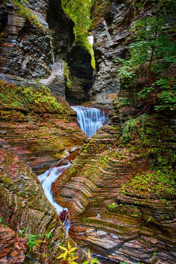 Waterfall through Gorge with Terraced Rock and Fall Leaves Stock Photo ...