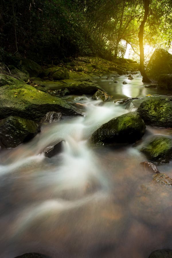 An Image of Waterfall in the Morning with Sun Rays Stock Image - Image ...