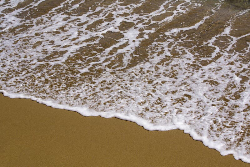 Wave on sand beach stock photo. Image of seaside, shiny - 113489374