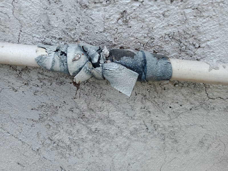Image of a White PVC Water Pipe Tied with a Black Rubbe Stock Image ...