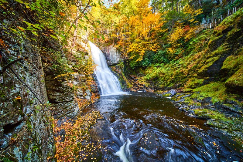 Wide Angle Gorge with Cliffs, Moss, Fall Leaves, and Raging Waterfall ...
