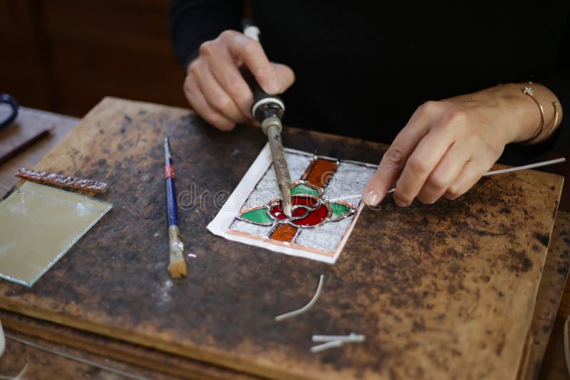 A Woman Creating Stained Glass Works Stock Photo - Image of indoors ...