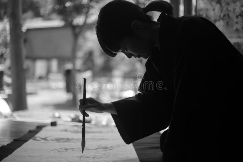 Female doing calligraphy stock image. Image of serious - 241189149