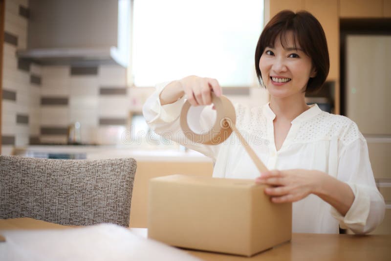 Woman packing work stock photo. Image of sunny, delivery - 242526674