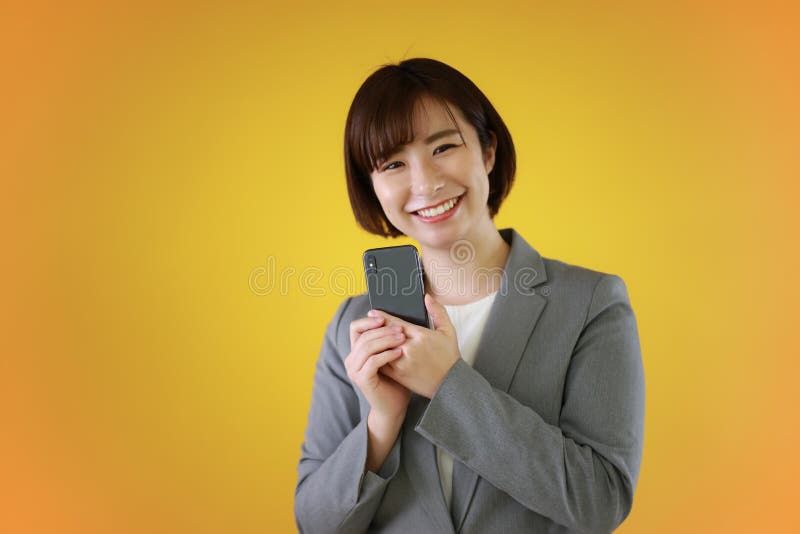 A Woman Operating a Smartphone Stock Image - Image of office, japan ...