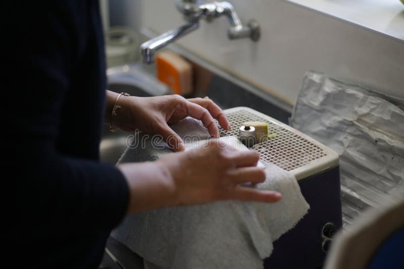 A woman polishing glass stock image. Image of artisan - 324980635