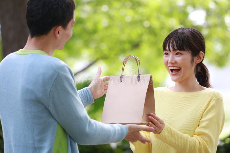 Female receiving a gift stock photo. Image of woman - 238935514