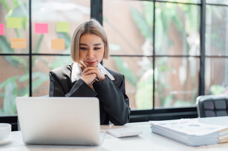 Image of Woman Thinking and Down Working Sitting at Table at Office ...