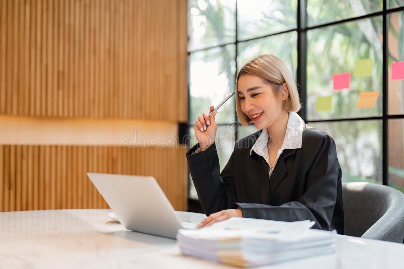 Image of Woman Thinking and Down Working Sitting at Table at Office ...