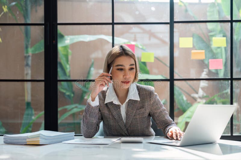 Image of Woman Thinking and Down Working Sitting at Table at Office ...