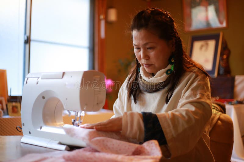 Woman Using a Sewing Machine Stock Image - Image of portrait, lifestyle ...