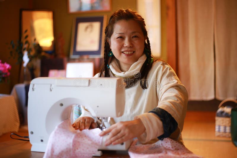 Woman Using a Sewing Machine Stock Image - Image of clothes, hobbies ...