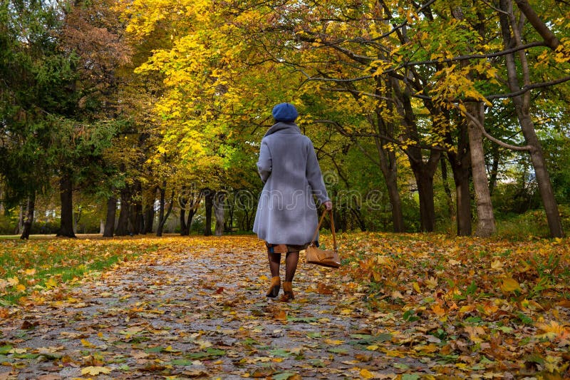 Man Walking Alone on a Riverbank, with a Rod in One Hand and a Net in ...