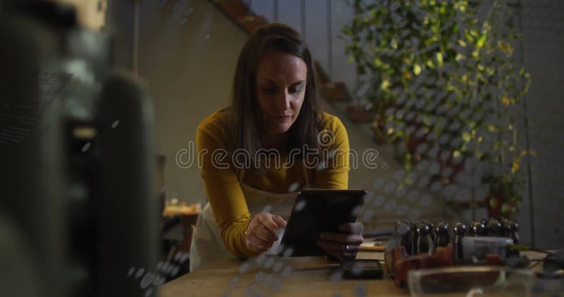 Image of Woman in Workshop Using Tablet, Focusing on Creative Project ...