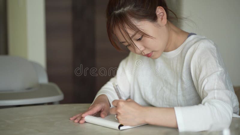 Woman writing a letter stock footage. Video of study - 325339196