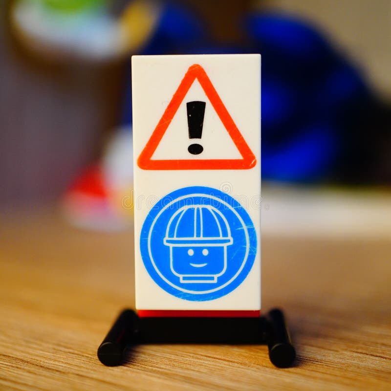 Image of a Wooden Table with a Construction Helmet and a Red and ...