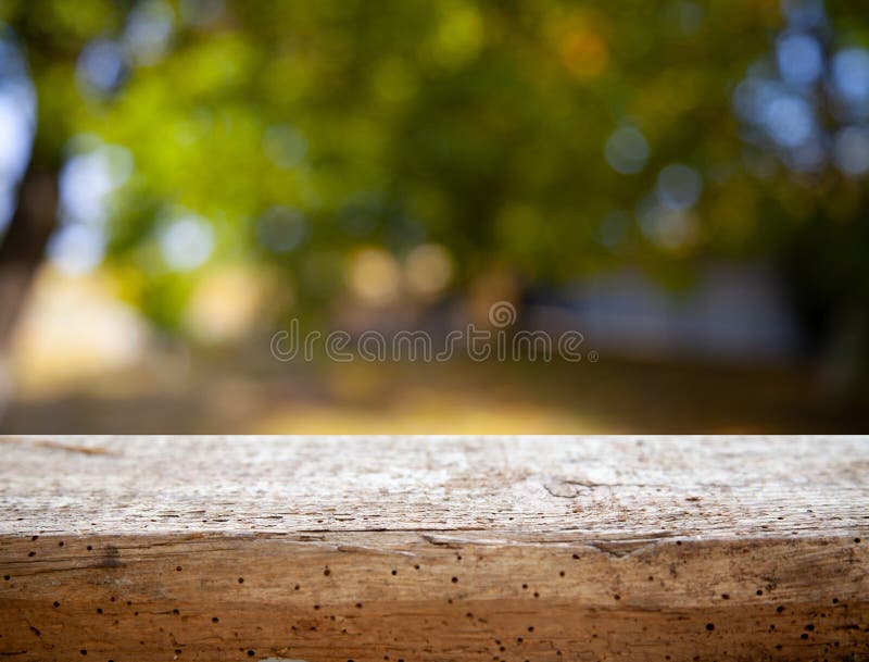.image of Wooden Table in Front of Abstract Blurred Background of Stock ...