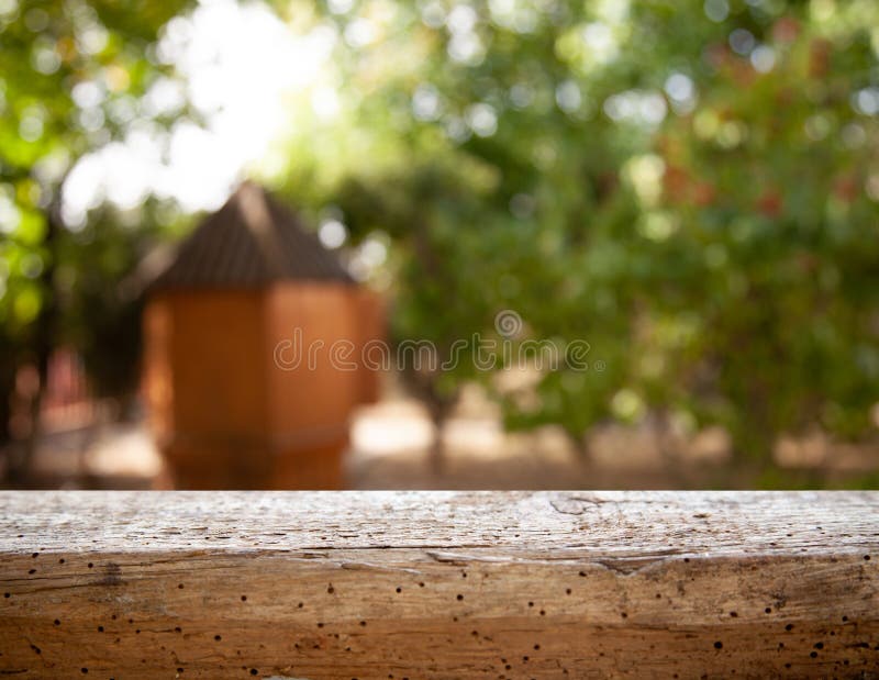 .image of Wooden Table in Front of Abstract Blurred Background of Stock ...