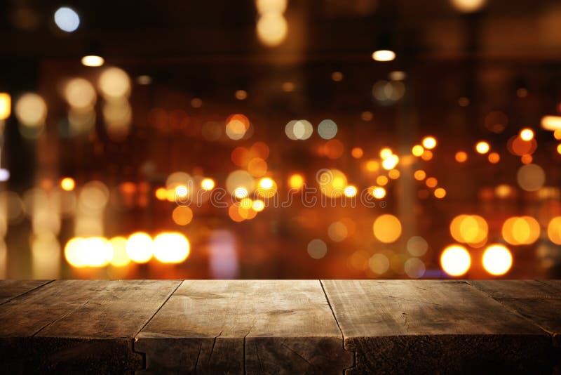 Image of Wooden Table in Front of Abstract Blurred Restaurant Lights ...