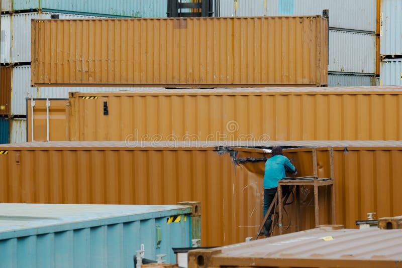 Image of a Worker Repairing a Container Stock Image - Image of label ...