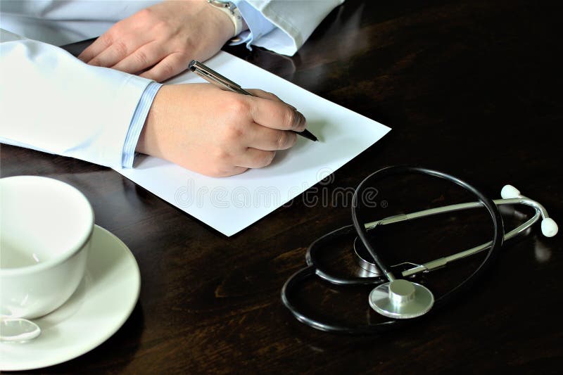 An Image of a Writing Doctor with Stethoscope Stock Photo - Image of ...