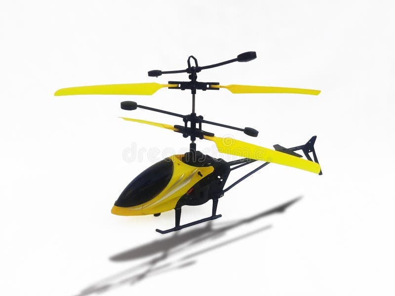 An Image of Yellow and Black Coloured RC Helicopter with Clear White ...