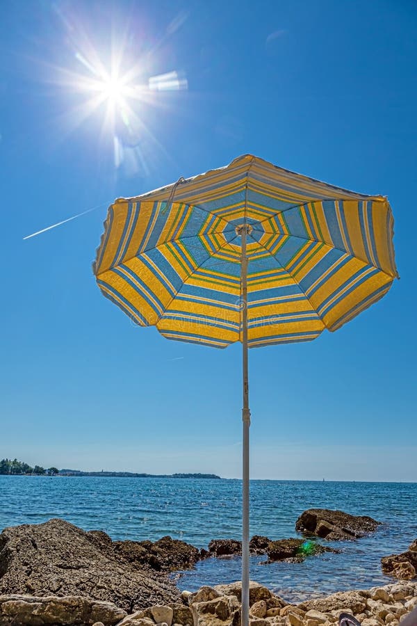 Image of Yellow Blue Colored Parasol in Front of Bright Blue Sky Stock ...