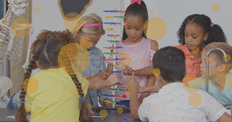 Image of Yellow Spots Over Diverse School Children in Classroom Stock ...